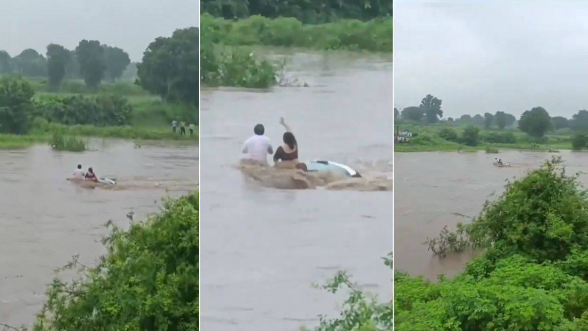 Viral Video: Couple Rescued After Being Stranded on Car Roof Amid ...